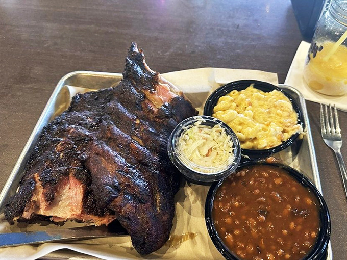 A rack of ribs so impressive it deserves its own ZIP code, flanked by sides that refuse to be overshadowed.