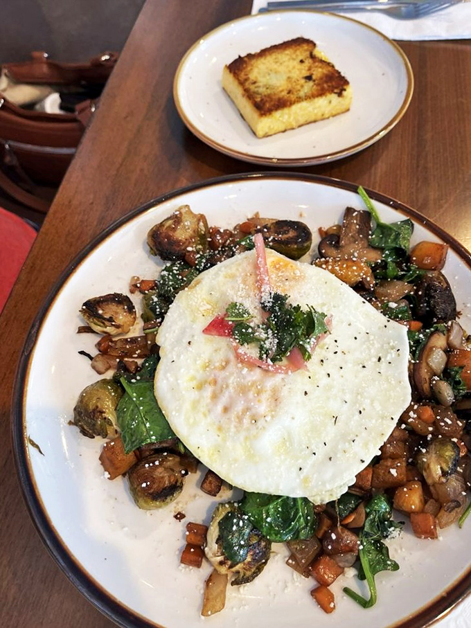 A garden hash that's practically a work of art—roasted vegetables and perfectly cooked egg create a breakfast that's both virtuous and decadent.