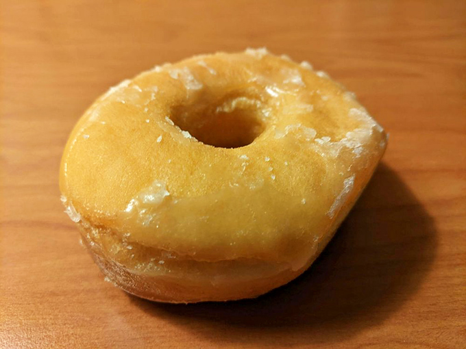 The humble glazed donut&mdash;proof that perfection doesn't need to be complicated. That glaze catching the light like morning dew on a very delicious flower.