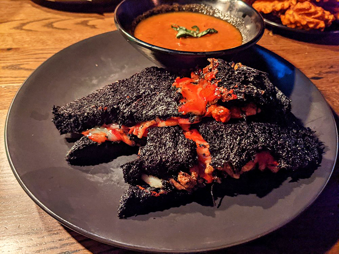 This blackened sandwich isn't burned&mdash;it's the "Grilled Cheese of Darkness," oozing with molten cheese that could warm even a vampire's heart. 