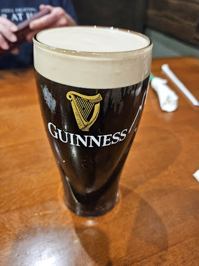 A properly poured Guinness with its perfect creamy head. They say patience is a virtue&mdash;this glass is proof that waiting those extra 119.5 seconds matters.