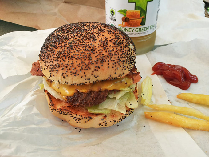 This isn't just lunch&mdash;it's a poppy-seeded masterpiece where bacon and cheese perform a duet so perfect it deserves its own Broadway show. 