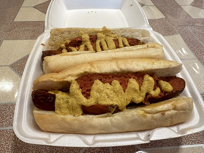 Hot dogs that graduated from the school of smoke with honors. Dressed with mustard and nestled in pillowy buns&mdash;proof that even classics can be elevated.