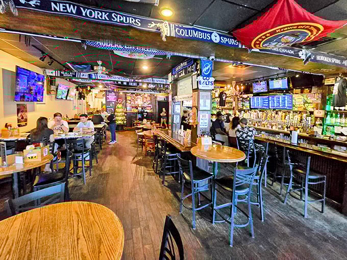 Sports scarves hang like battle flags above patrons enjoying liquid treasures below. This is where Tampa comes to cheer, chat, and chill.