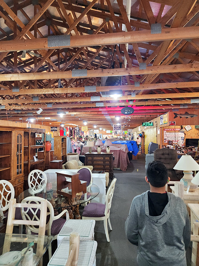 Wooden beams frame an interior landscape of furniture possibilities, where shoppers mentally redecorate their homes with each new discovery.