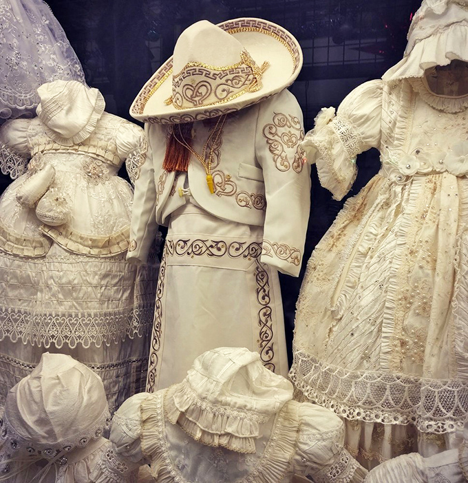 Elaborate ceremonial outfits showcase intricate embroidery and craftsmanship. These aren't just clothes but cultural heritage preserved in fabric and thread.