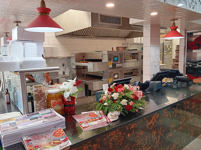 The kitchen, heart and soul of Rudy's operation, hums with the kind of efficient choreography that would make Broadway producers jealous.