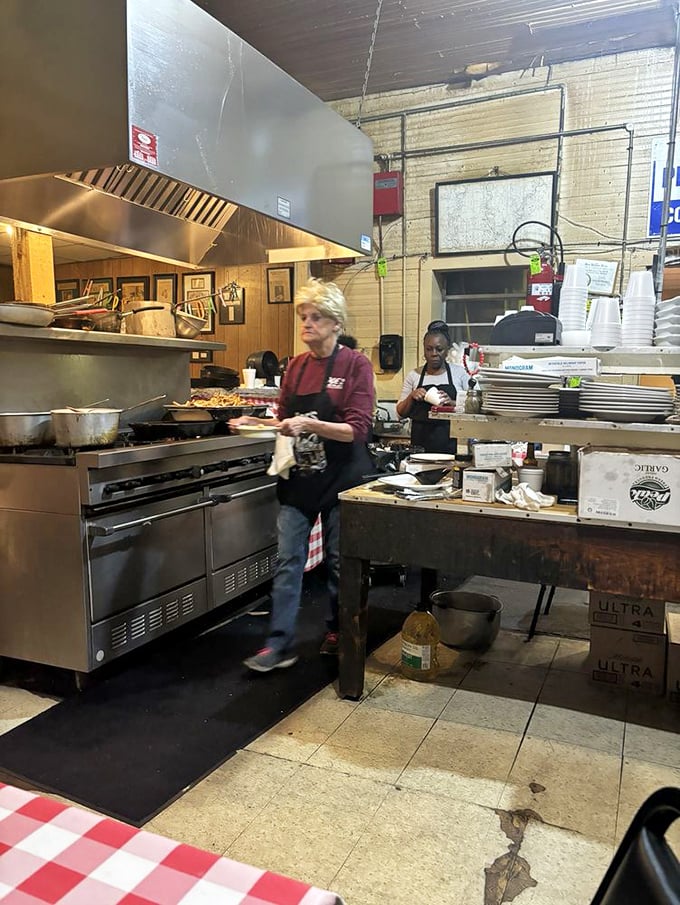 No fancy equipment, just decades of know-how and well-seasoned surfaces. This kitchen has forgotten more about cooking than most will ever learn. 