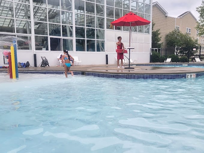 The outdoor pool: where kids practice their Olympic diving routines while parents practice their "please don't require medical attention" meditation techniques.
