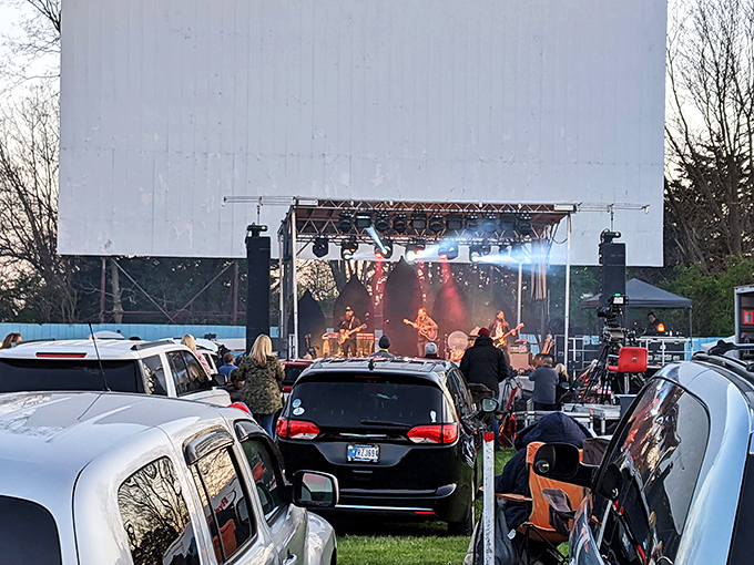 Live music beneath the towering screen&mdash;drive-ins evolve from simple theaters to full-blown cultural hubs under Indiana's evening sky.