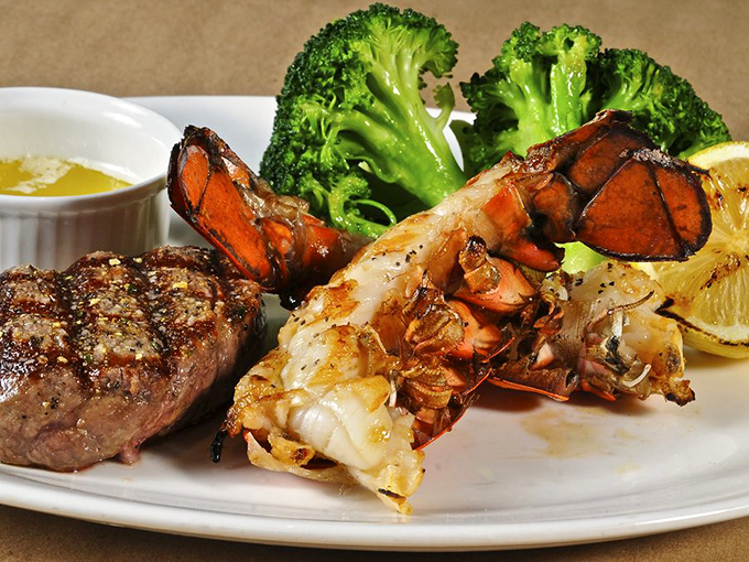 Surf and turf perfection&mdash;a petite filet alongside a lobster tail with drawn butter. Some traditions exist because they simply cannot be improved upon.