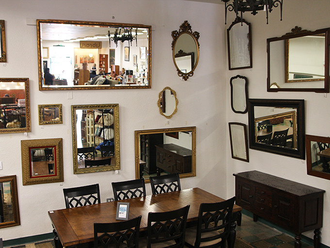 The mirror wall isn't just functional&mdash;it's a gallery of frames that turns simple reflection into art, multiplying beauty with each gilded edge. 