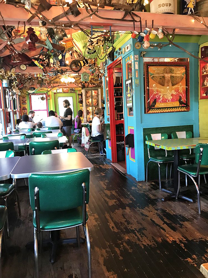 Retro turquoise chairs invite you to sit and stay awhile. The walls and ceiling compete for your attention while your food cools.