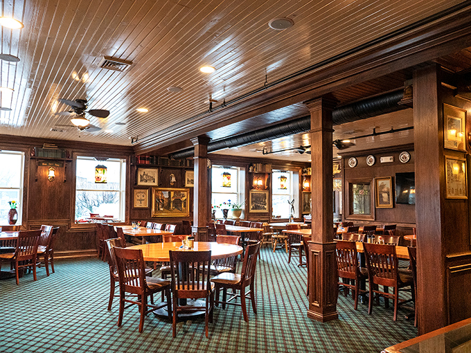 A dining room where the wood paneling and green carpet say "tradition," but the vibe says "stay as long as you like." 