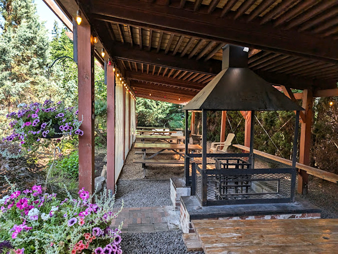 The exterior view shows the restaurant nestled among Pacific Northwest greenery. Even the landscaping complements the rustic barbecue vibe.