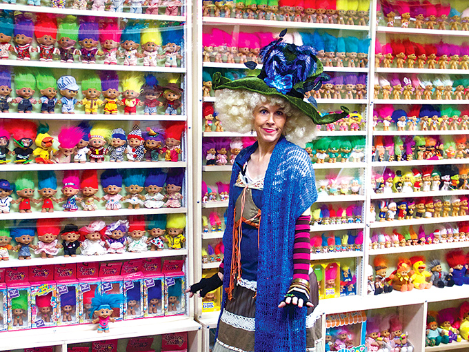 The museum celebrates troll fashion through the decades. Standing amid thousands of colorful specimens, this elaborately dressed guide brings historical context to what could otherwise be chaos.