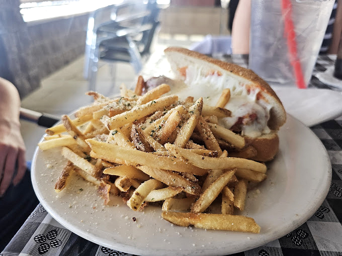 The Philly cheesesteak and fries – a meal so satisfying it should come with its own victory dance and trophy.
