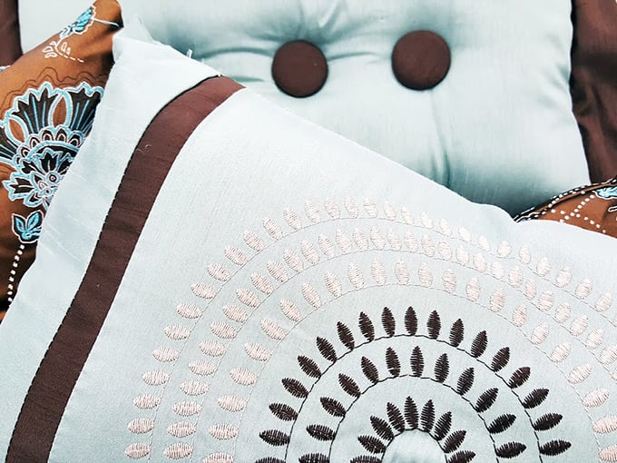 Embroidered throw pillows that instantly transform "just moved in" to "thoughtfully decorated" with minimal investment.