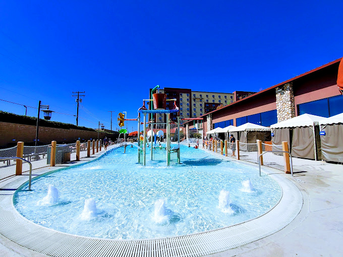 The shallow play area: where toddlers rule supreme and adults are merely tall obstacles to navigate around.