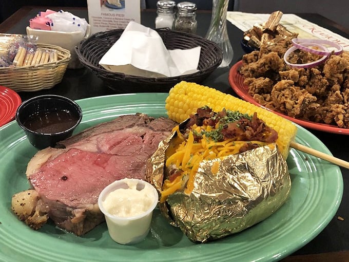 Prime rib cooked to that perfect shade of pink, with a loaded baked potato and fried something-or-other that's about to disappear first. Oklahoma on a plate.