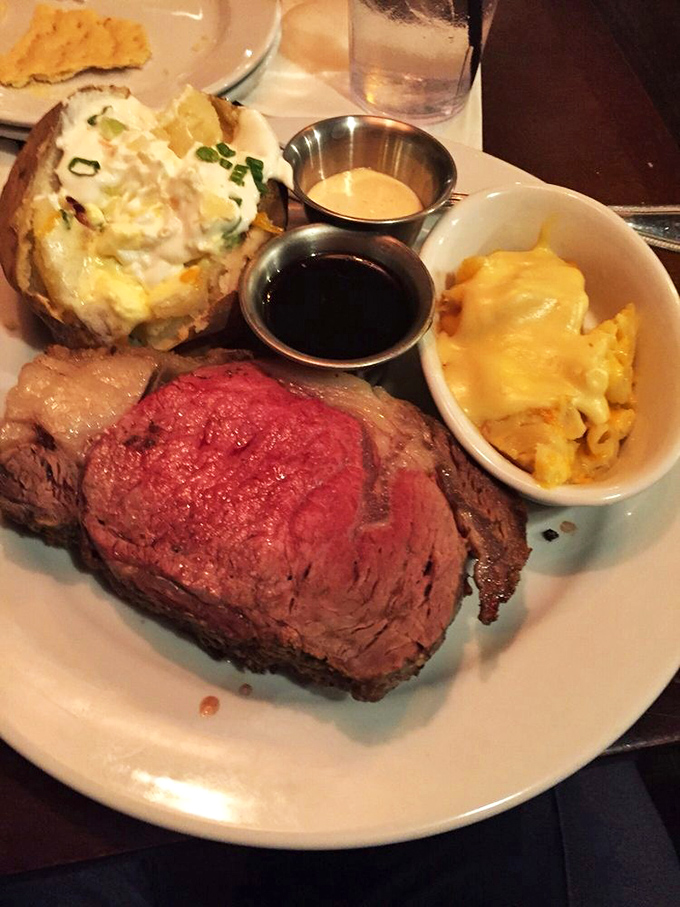 The loaded baked potato alongside that prime rib isn't playing a supporting role&mdash;it's co-starring in a flavor production worthy of a standing ovation.