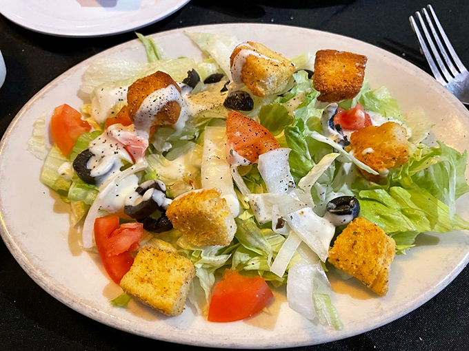 A proper Caesar salad that understands its role: bringing freshness and crunch while not trying to steal the spotlight from pasta.