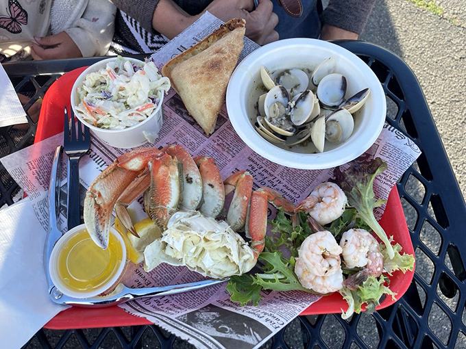 The seafood platter that makes sharing both necessary and nearly impossible. Crab legs, shrimp, and clams create a maritime mosaic that's almost too beautiful to disturb.