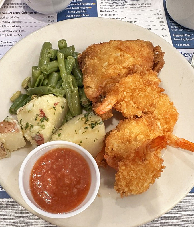 These golden-fried shrimp demand your attention, while the green beans and red-skinned potatoes stand by as worthy supporting actors in this delicious drama.
