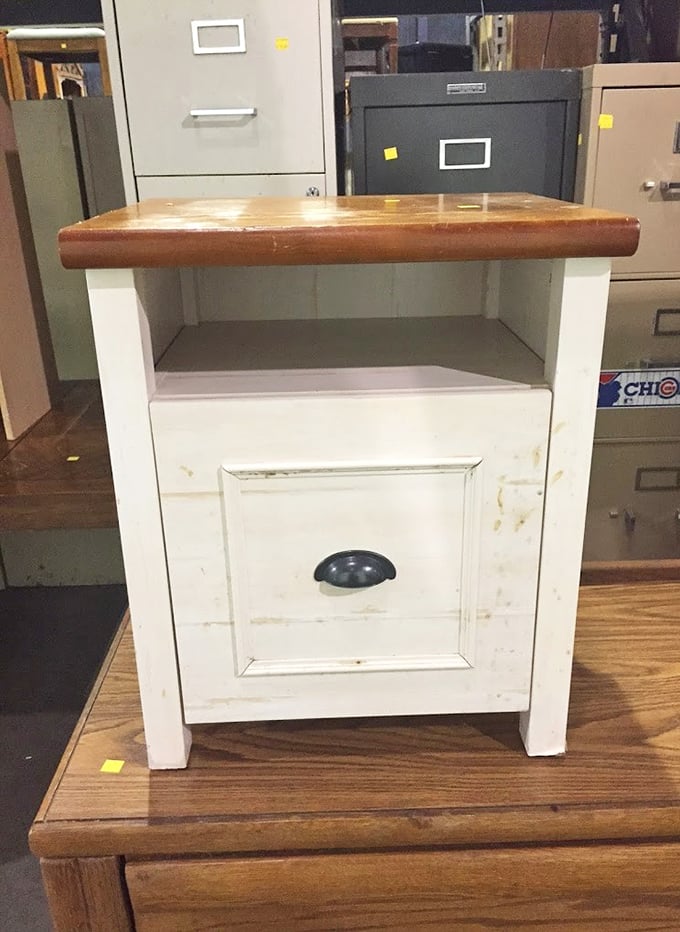 That distressed white nightstand has seen things, but with a little TLC, it's ready to hold your midnight snacks and mystery novels.