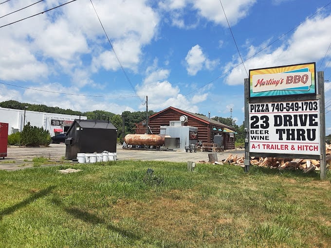 That sign isn't just advertising&mdash;it's a beacon of hope for hungry travelers seeking salvation in smoked meat form.