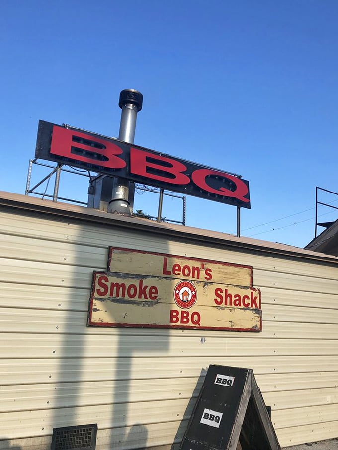 That weathered BBQ sign isn't just advertising&mdash;it's a beacon of hope for the hungry, a North Star for those lost in a sea of mediocre meals.