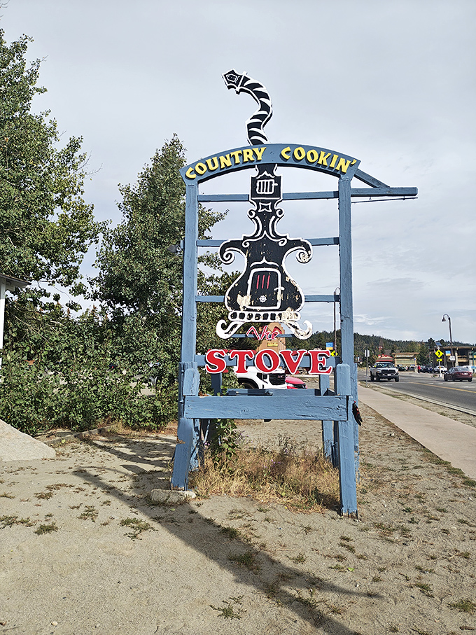 The roadside sign stands like a sentinel of satisfaction, guiding hungry travelers to their breakfast destiny with retro charm.