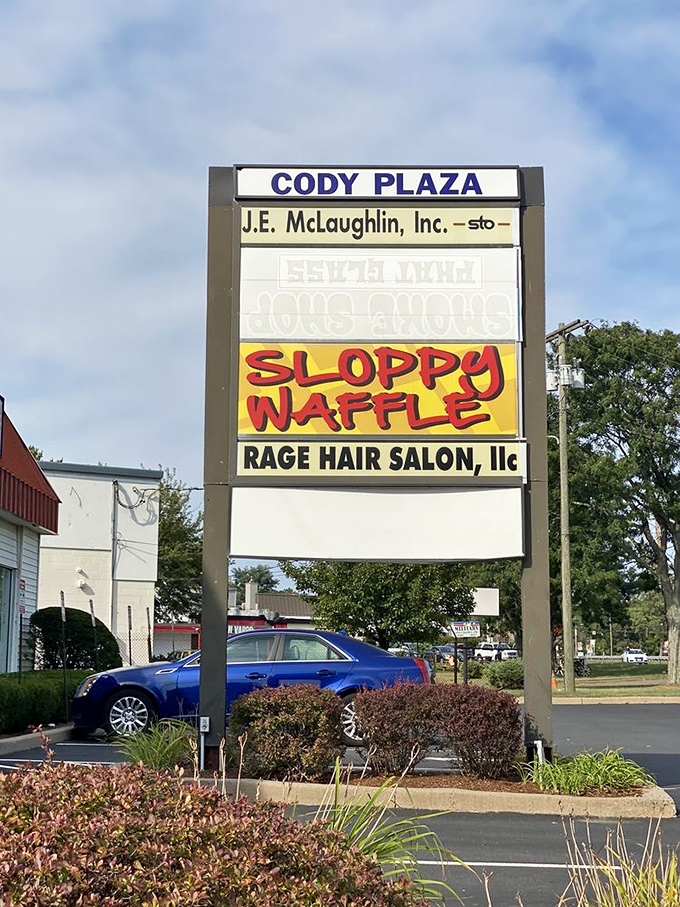The Sloppy Waffle announces itself boldly from the Cody Plaza sign, a beacon of breakfast hope in a sea of ordinary options.