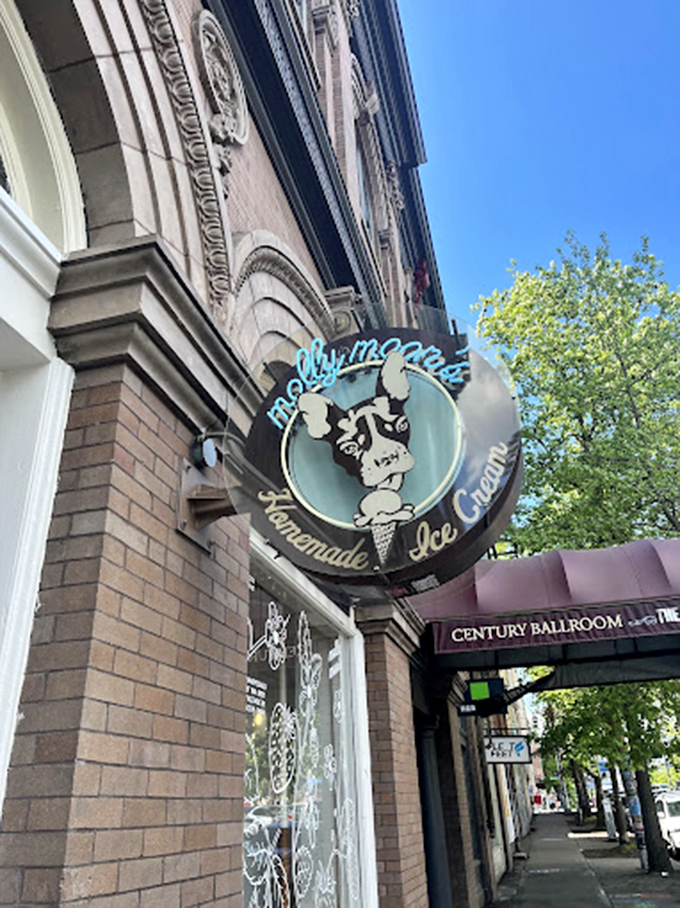 Where ice cream dreams come true beneath exposed beams and pendant lights. The minimalist "ICE CREAM" sign states the obvious with refreshing honesty. 