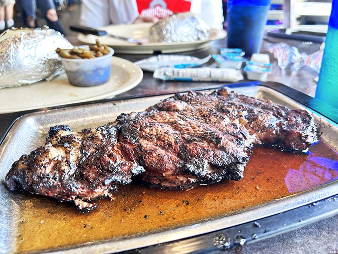 What they call "small" would be labeled "enormous" anywhere else. The juices pooling on the tray are liquid gold.