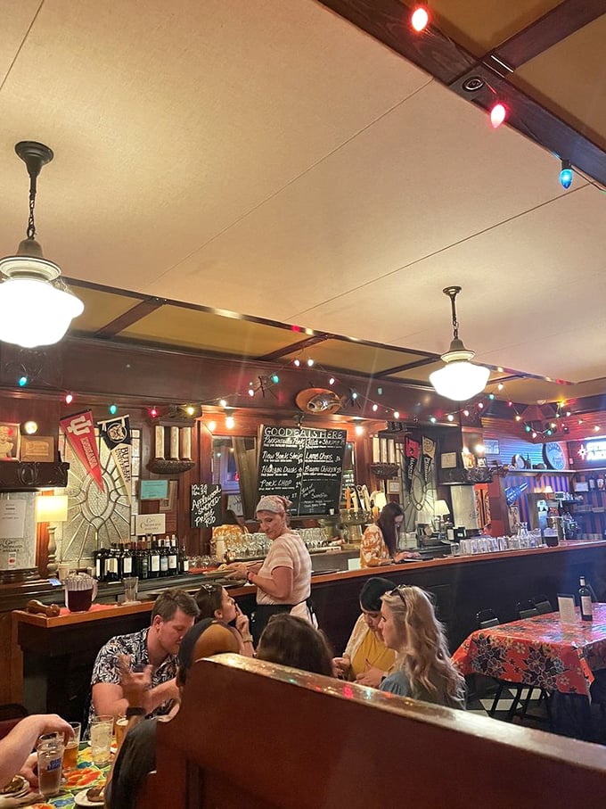 The heart of Bonge's beats behind the bar. String lights create the perfect backdrop for culinary magic that unfolds nightly.