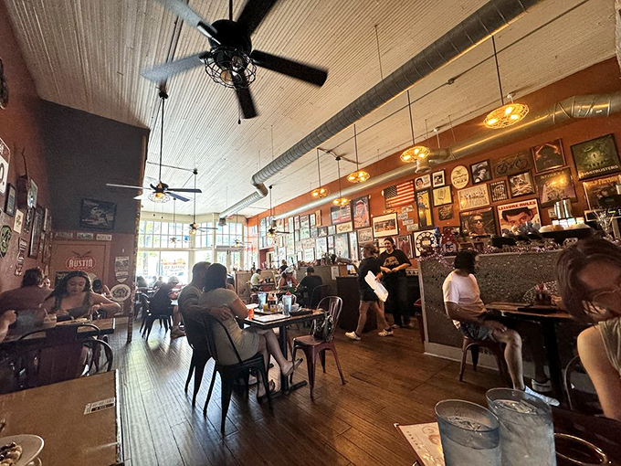 An interior where nostalgia meets modern comfort. The walls tell stories while ceiling fans keep the Texas heat at bay.