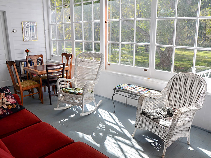 The sunroom&mdash;where wicker furniture and abundant natural light create the perfect spot for morning coffee or evening wine.