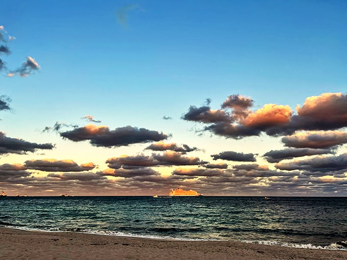 Cloud formations that make you question your artistic abilities. Mother Nature showing off her sunset palette while beachgoers stand in awe.