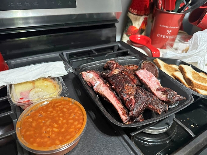 Leo's to-go is practically a religious experience &ndash; ribs, beans, and cake that transform your kitchen table into the best restaurant in town.