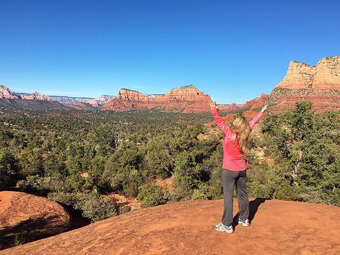 The victory pose that says "I climbed a mountain and all I got was this spectacular panoramic view."