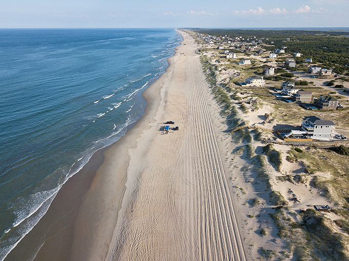From above, the relationship between land and sea reveals itself—a constantly negotiated boundary that shifts with each tide.