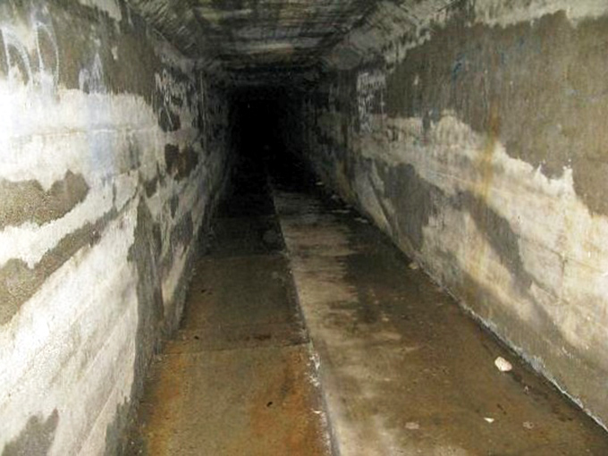 Another view of the Body Chute&mdash;its concrete walls have absorbed more sorrow than any structure should bear in a lifetime.