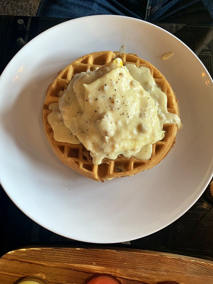 A golden waffle crowned with savory gravy&mdash;comfort food elevated to an art form that makes you question why you'd ever eat breakfast any other way.