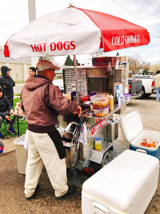 Rain or shine, the Garcia's cart stands ready. The weather might change, but the dedication to hot dog excellence remains constant.