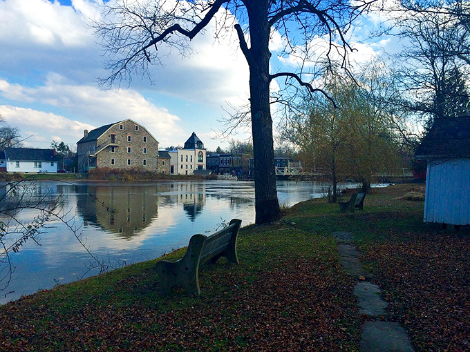 Riverside benches await contemplative souls, offering front-row seats to nature's slow-motion masterpiece of reflection and stillness.