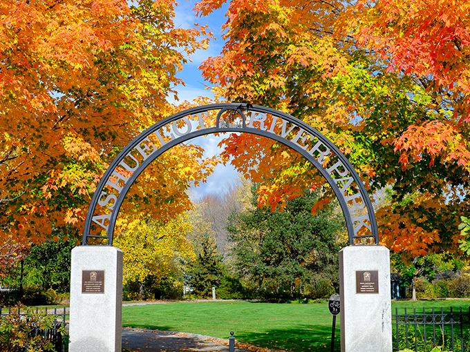 Ashuelot River Park's entrance frames autumn's masterpiece. Mother Nature's paintbrush works overtime during fall in New Hampshire.