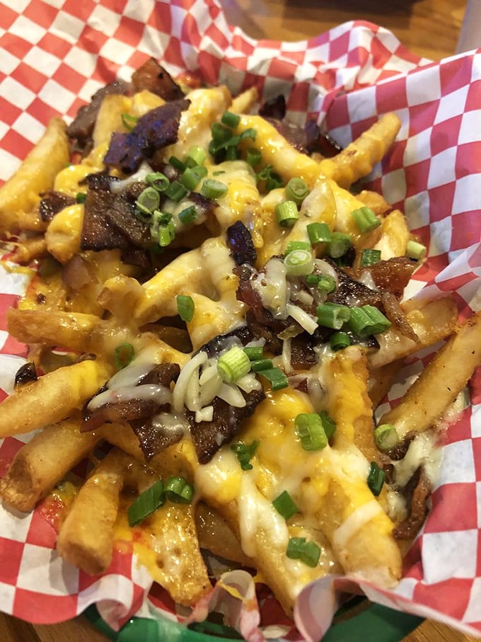 Loaded fries that make French cuisine seem unnecessarily complicated: crispy potatoes, melty cheese, smoky meat, and green onions for "health."