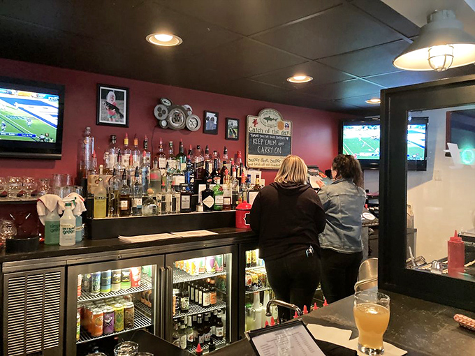 The bar where liquid happiness flows freely. Those TVs ensure you won't miss the game while pursuing your burger bliss.
