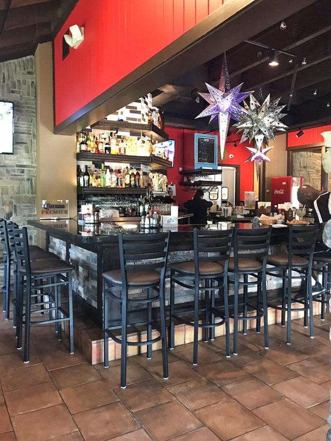 The bar area glows with promise under festive star lanterns. Where margarita dreams come true and Monday worries dissolve.